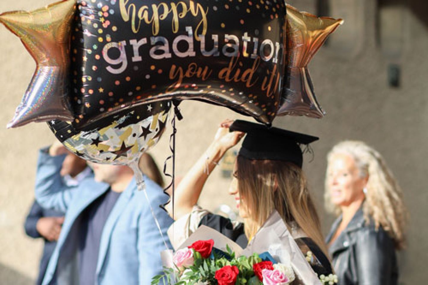 City graduates celebrate at the first in-person graduation in almost ...